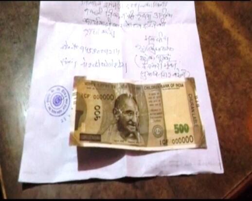children bank notes coming out of the ATM in Bareilly